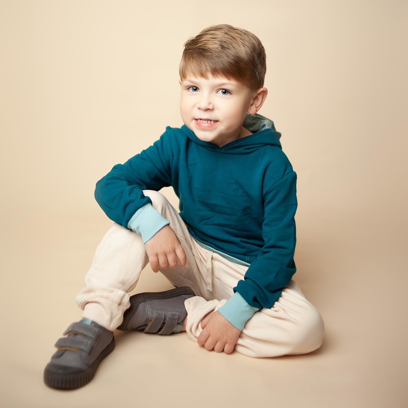 Fleece Kangaroo Pocket Pullover with Dino Spikes in Peacock with Storm